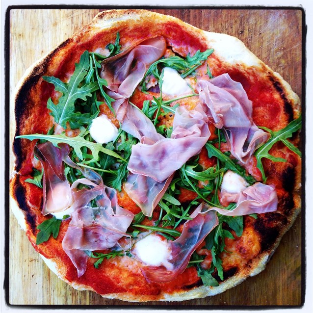 Pizzeria At Home. Benchtop Pizza Oven Pizza With Prosciutto, Rocket and ...